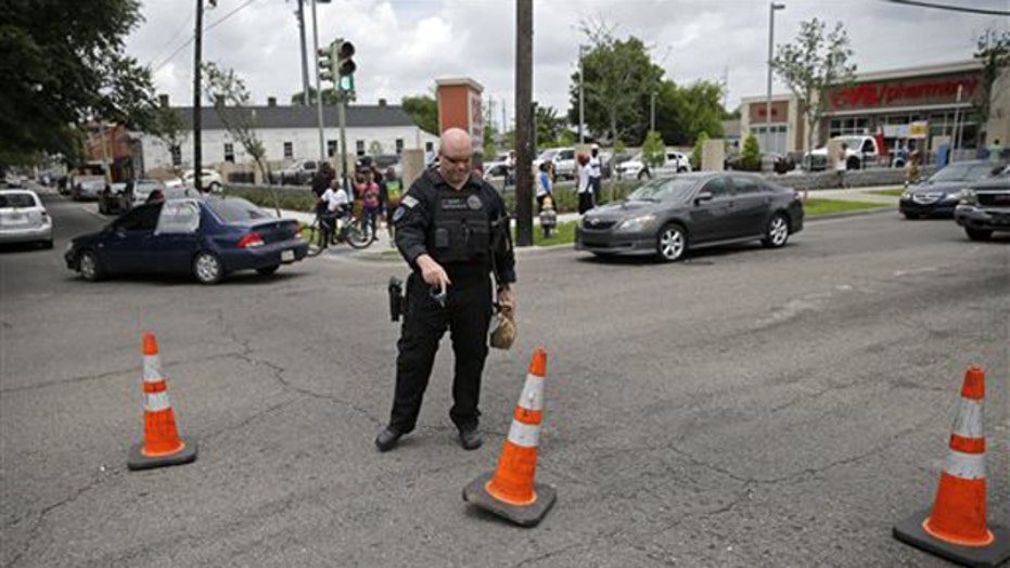 Manhunt After New Orleans Cop Fatally Shot By Suspect He Was