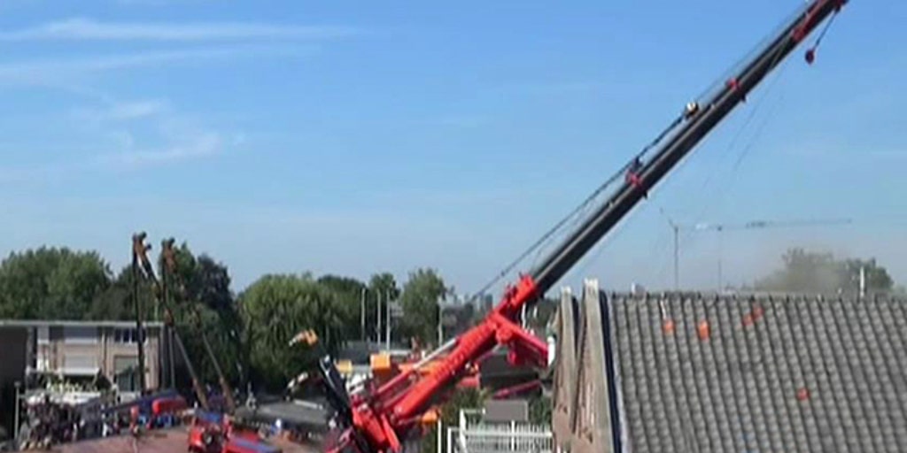 Cranes collapse into row of homes injuring at least 20 | Fox News Video