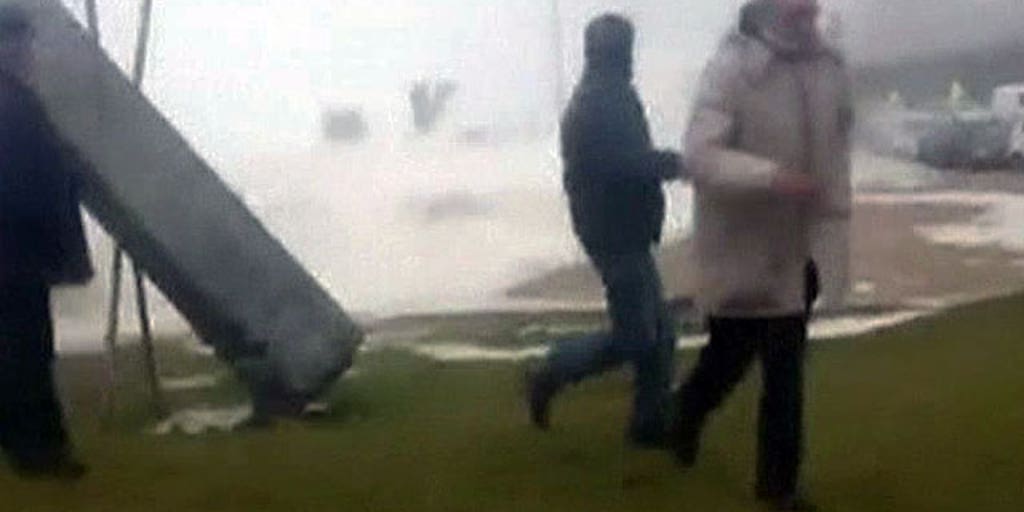 Wipe out: Spectators scatter when massive wave jumps seawall | Fox News ...