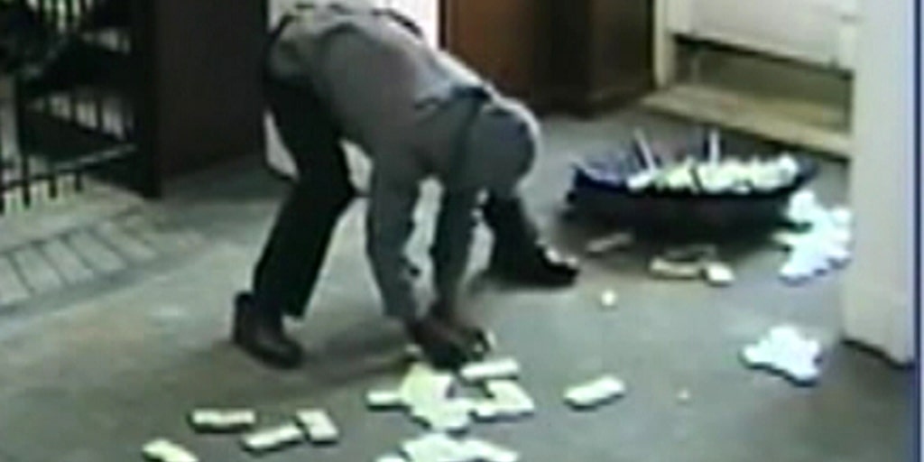 Bumbling bank robber without bag uses umbrella to carry cash | Fox News ...