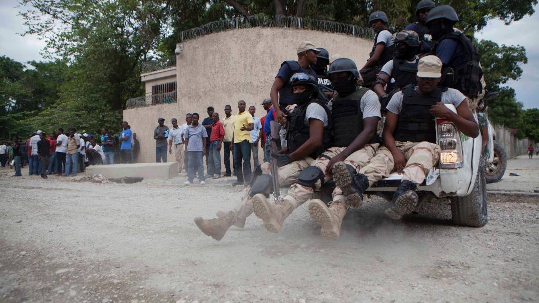 Haiti Police Unit Posted At Home Of Former President Aristide