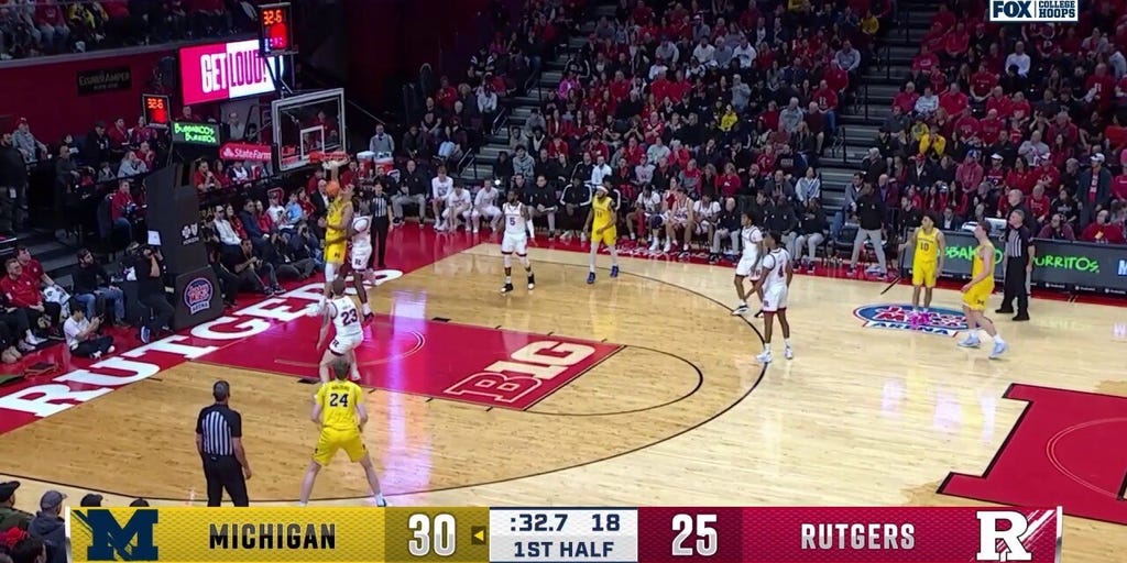 Vladislav Goldin hammers the one-handed jam, extending Michigan's lead ...