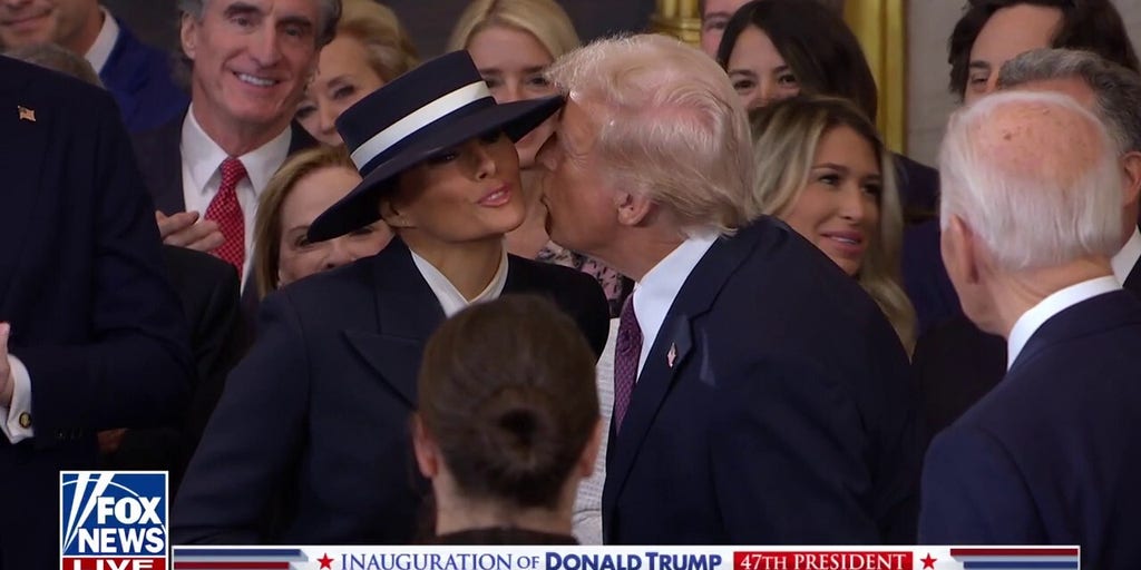 Trump attempts to kiss Melania as he enters the swearing-in ceremony ...