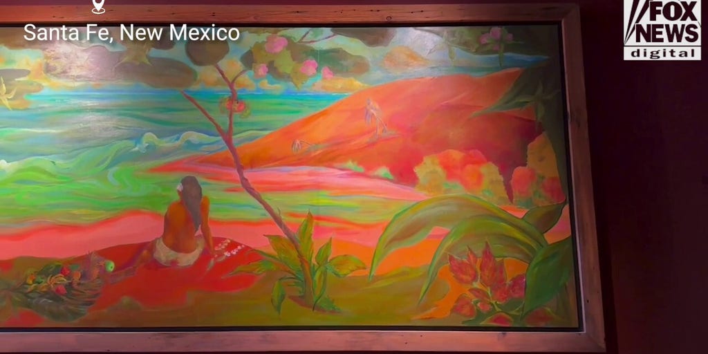 A large portrait of a tropical landscape painted by Gene Hackman hangs ...