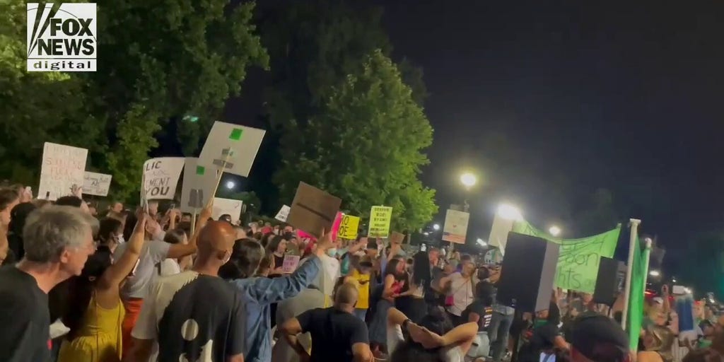 Pro-choice protestors chant "Rise up for abortion rights" outside of ...