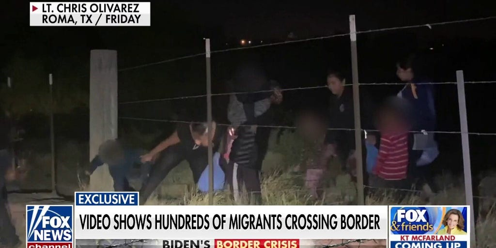 Exclusive Video Shows Hundreds Of Migrants Crossing Southern Border