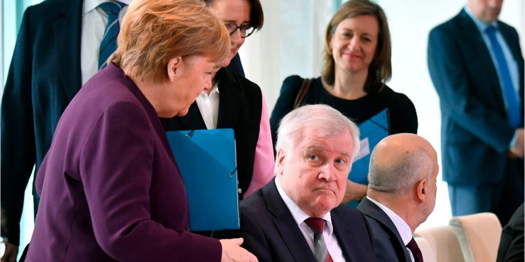 Angela Merkel rebuffed an attempted handshake with Germany interior ...
