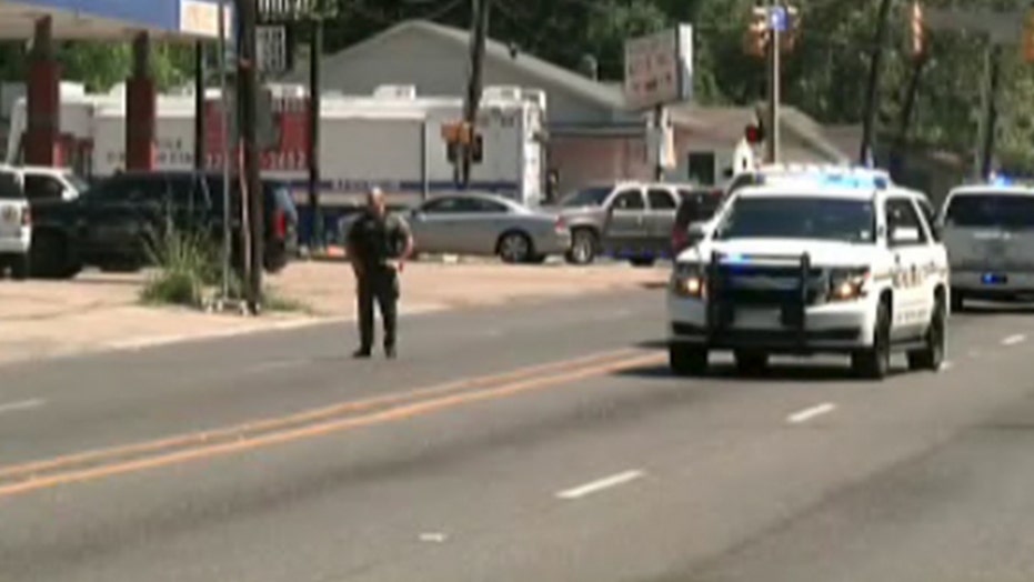 Baton Rouge officer shot dead, another wounded, police say; suspect in ...