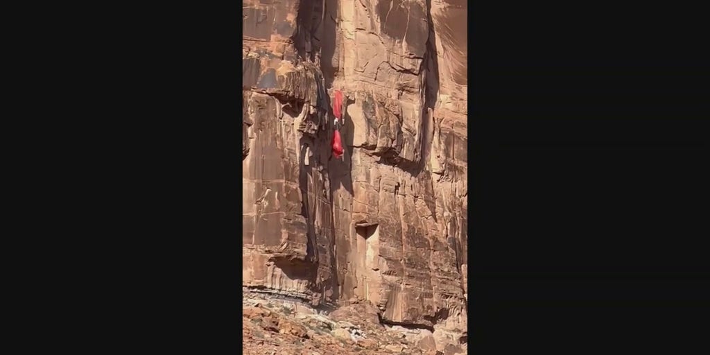 Utah BASE jumper slams into cliff, suspended on ledge in harrowing video | Fox News Video