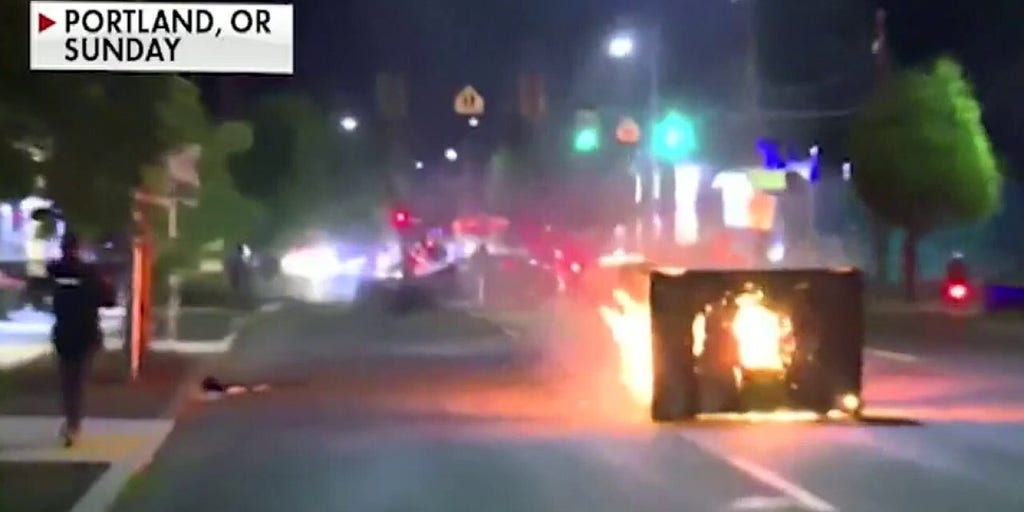 Police declare riot in Portland after protesters march on police union ...