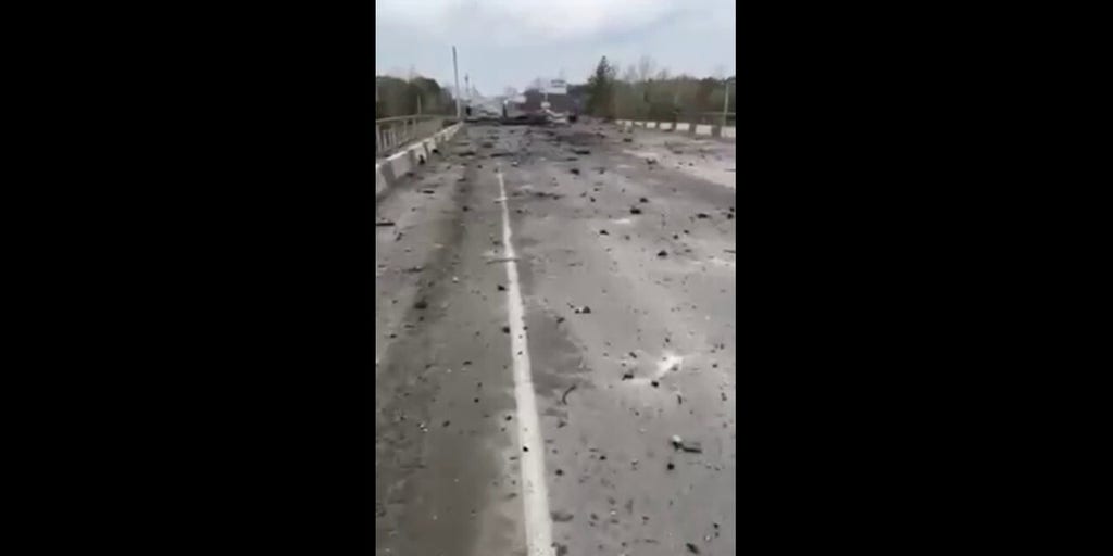 Cratered road near Kyiv taken by local Ukraine woman | Fox News Video
