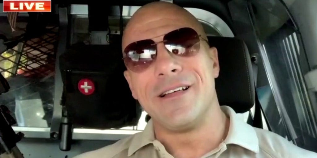 Police officer reacts to going viral as Dwayne 'The Rock' Johnson ...