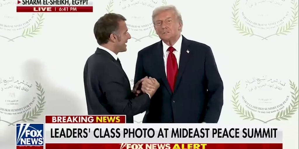 U.S. President Donald Trump and French President Emmanuel Macron share ...