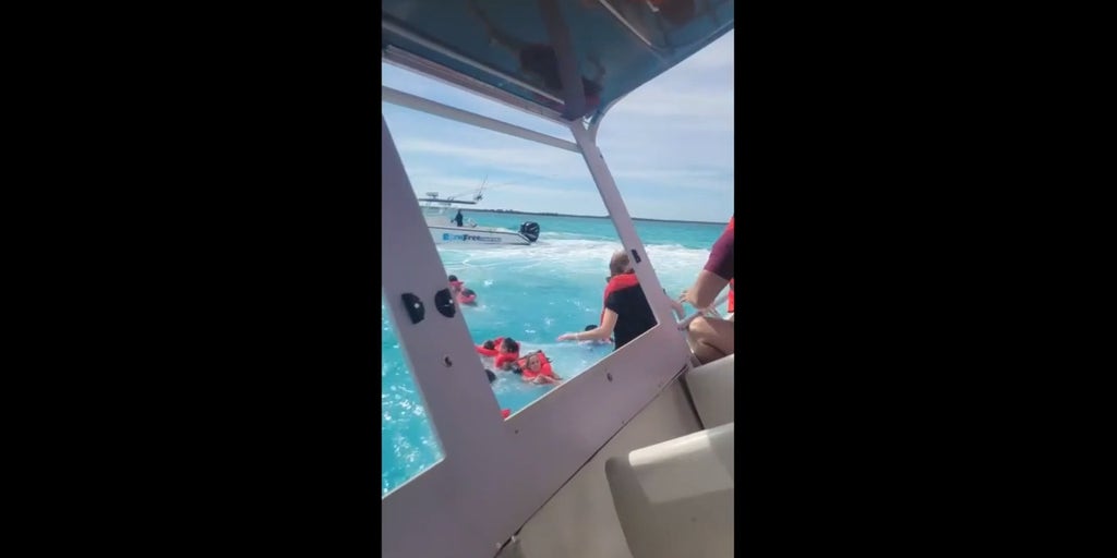 Bahamas tour boat passenger films vessel sinking, people jumping ...