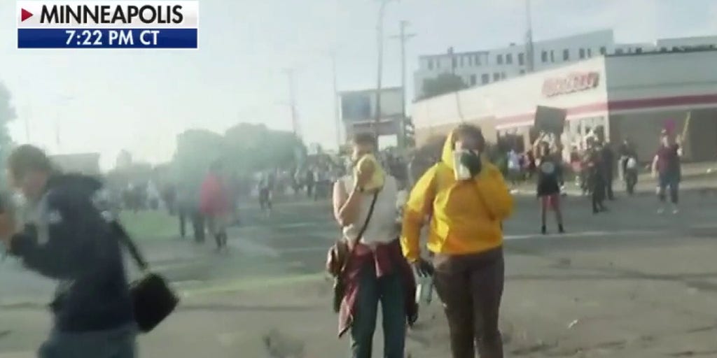 Protesters in tense standoff with police following riots in Minneapolis ...