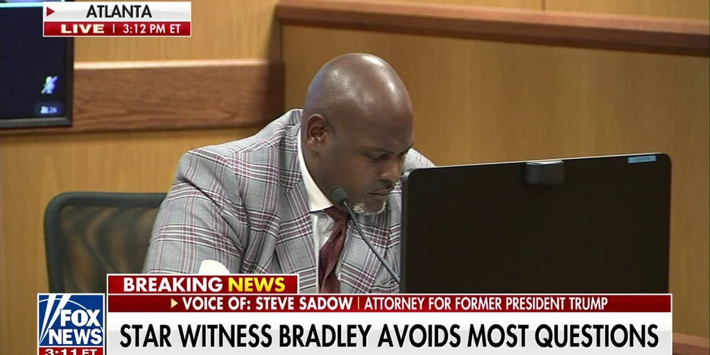 Terrence Bradley appears to mutter 'dang' when confronted with texts about Fani Willis affair ...
