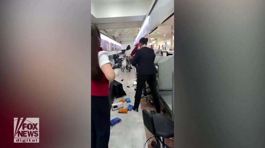 Tantrum by a traveler: Woman is shown in video attacking airline check ... Tantrum by a traveler: Woman is shown in video attacking airline check ...