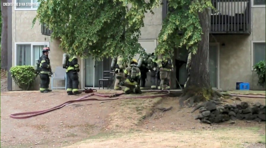 Apartment explosion caught on video as firefighters escape in ...