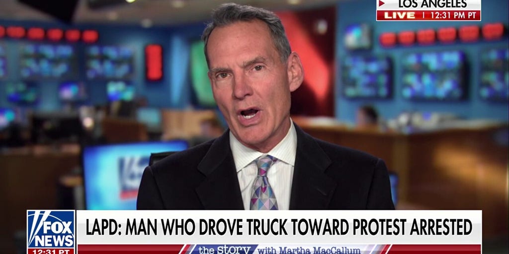 Man arrested, held without bail after allegedly driving truck into ...