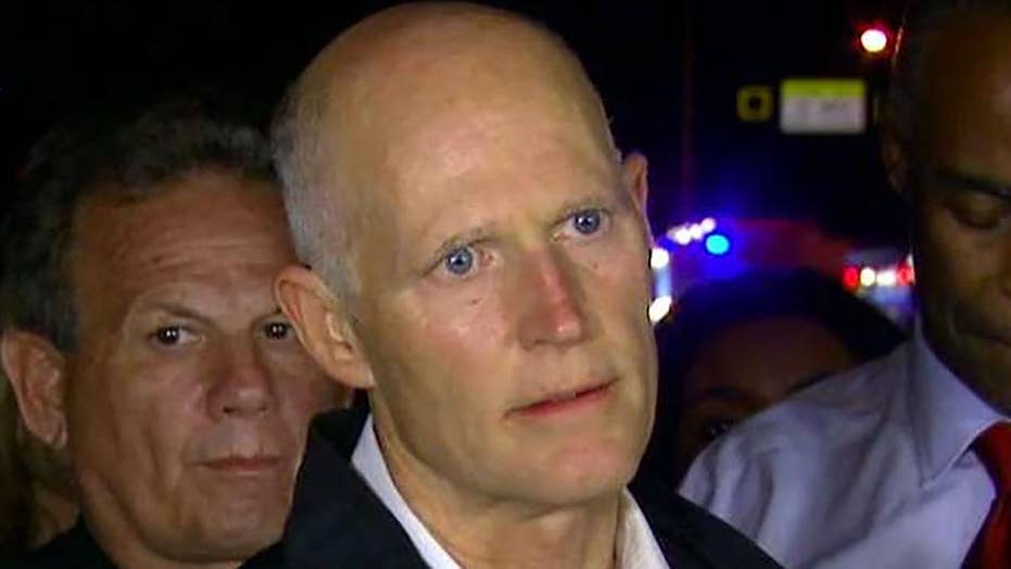 Florida Gov. Rick Scott signs gun bill following Parkland massacre, in ...