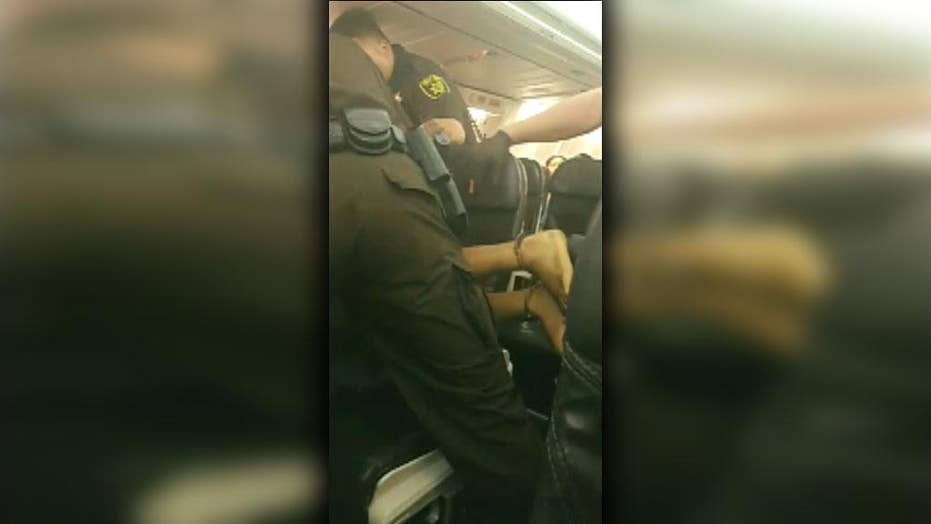 Shirtless Alaska Airlines Passenger Restrained Forcefully Removed From