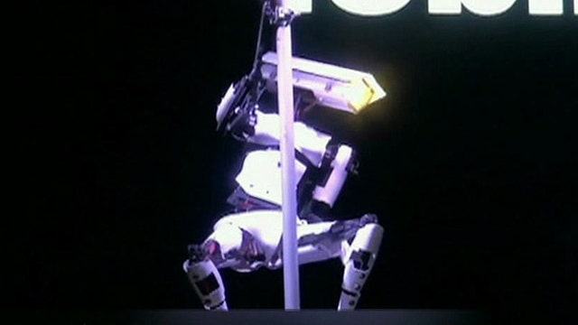 Robots pole dance at German computer expo | Fox News Video