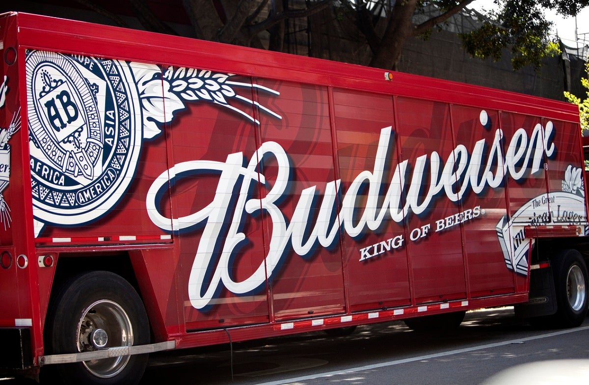 Budweiser parent cuts interim dividend, 3Q net profit falls | Fox Business