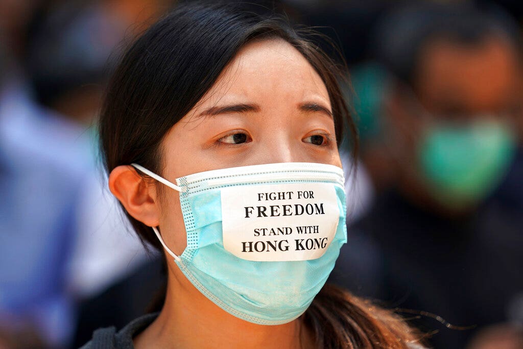 Hong Kong Protesters Defy Mask Ban With Bricks And Gas Bombs Fox Business