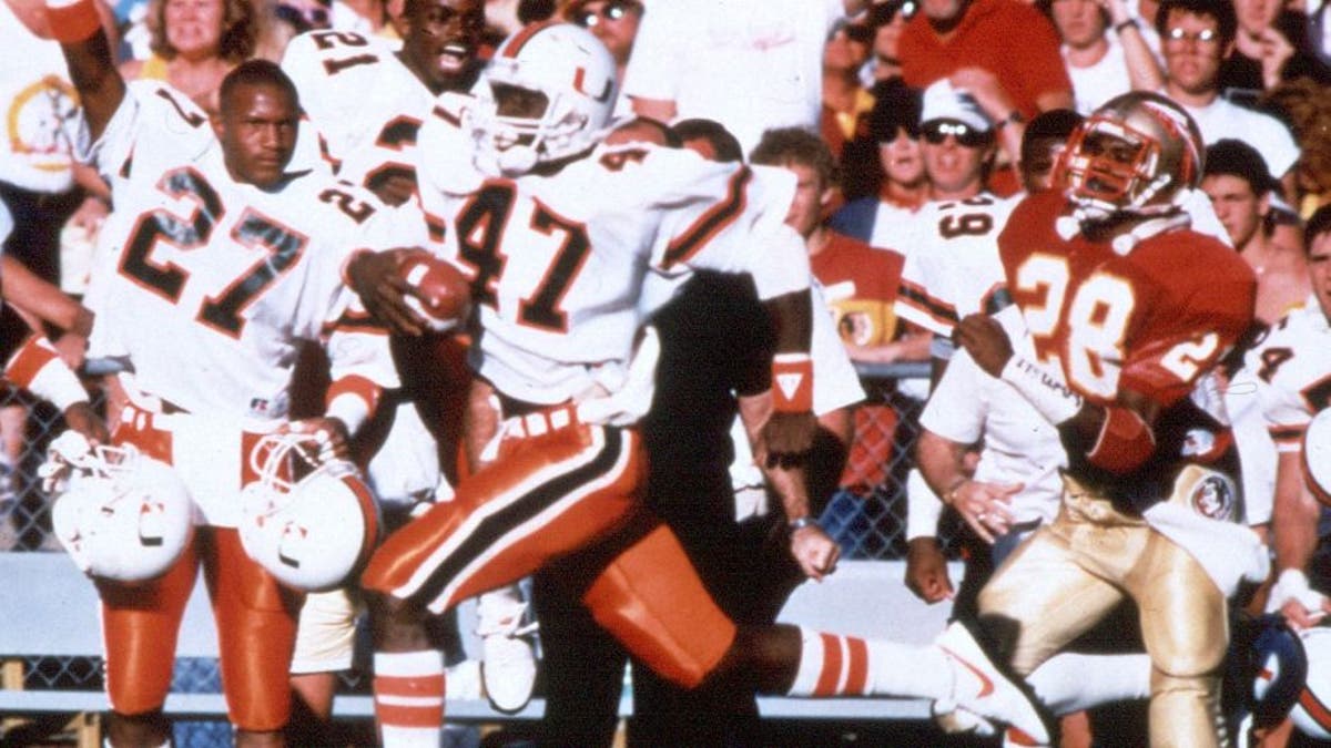 Photo: Former 'U' star Michael Irvin shows his support for Hurricanes ...