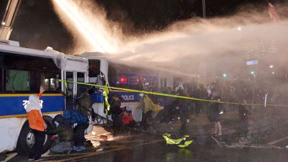 South Korean police question dozens after violent ferry protest