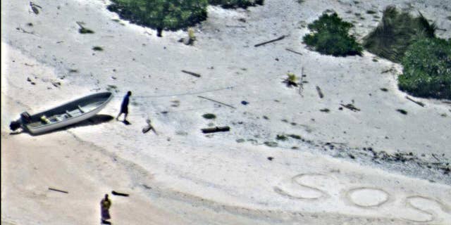 'SOS' in sand leads to rescue of 2 people stranded on island | Fox News