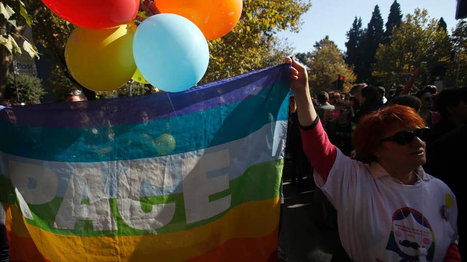 Peaceful gay pride held amid police protection in conservative EU ...