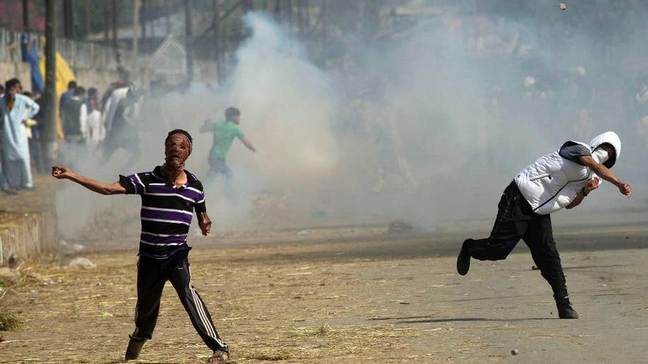 Government forces fire tear gas to control anti-India protests after ...