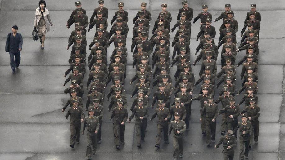 Goose-stepping soldiers march as North Korea holds celebration for ...