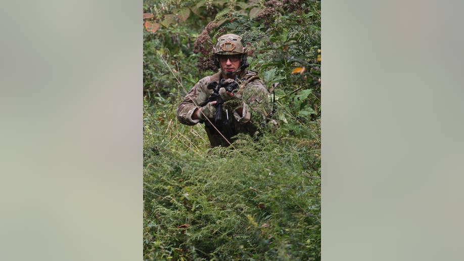 Police on manhunt for suspect in deadly trooper ambush find pipe bombs ...