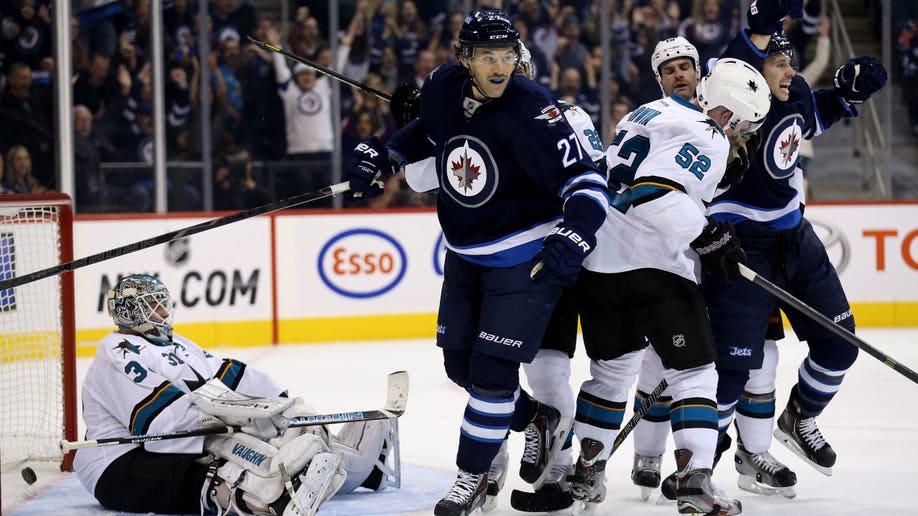 Andrew Ladd forces overtime, then scores shootout winner to rally Jets ...