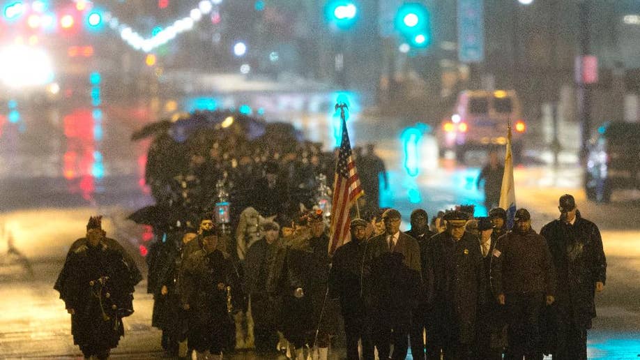 Philadelphia Police Officer Killed While Trying To Stop Robbery Is