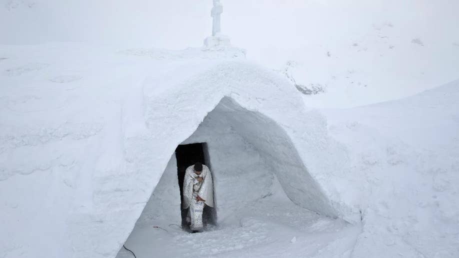 Romanian Ice Church at 2,000 meters (6,600-feet) high gives warm ...