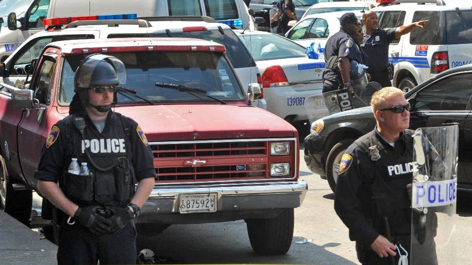 Baltimore police: Man arrested on gun charge near scene of recent ...