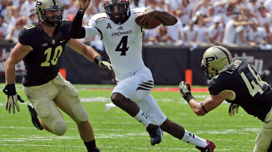 Cincinnati QB Munchie Legaux tries to return from horrific knee injury ...