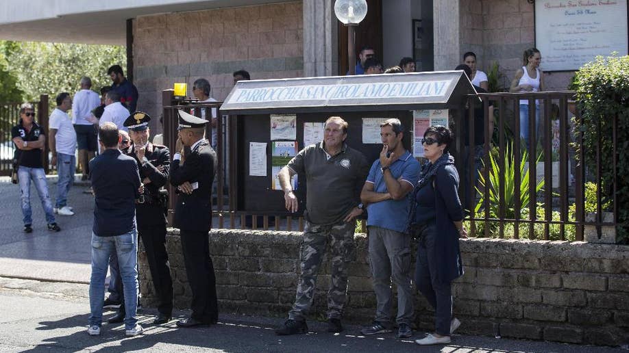 Italian police form human chains to keep peace at memorial service for ...