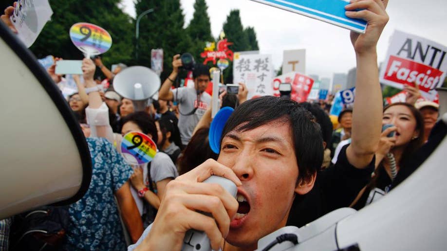 Tens of thousands rally outside Japanese parliament to protest divisive ... Tens of thousands rally outside Japanese parliament to protest divisive ...