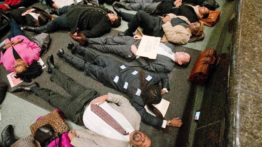 Defense Lawyers March To Protest Criminal Justice Systems Handling Of