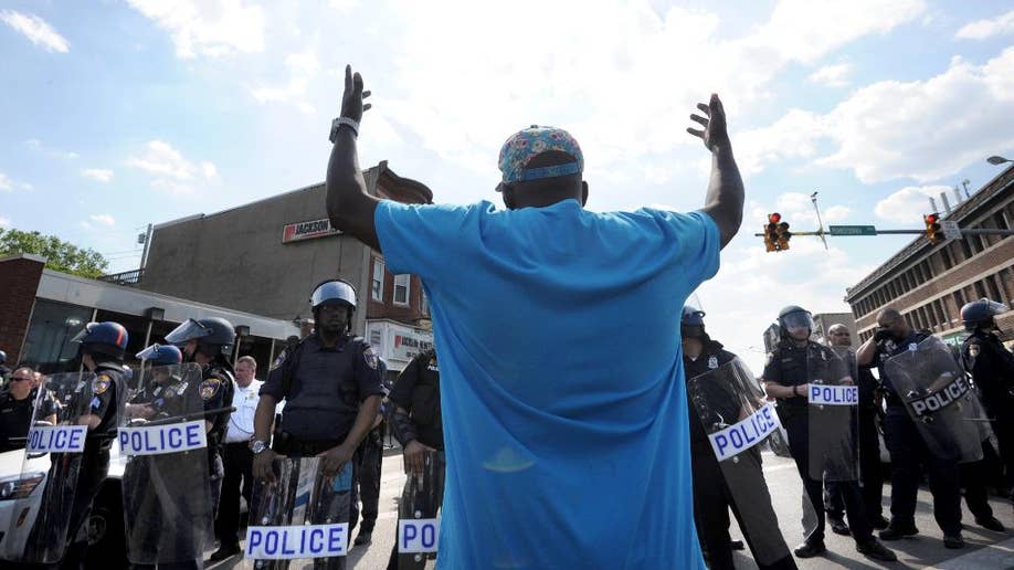 Baltimore police: Man arrested on gun charge near scene of recent ...