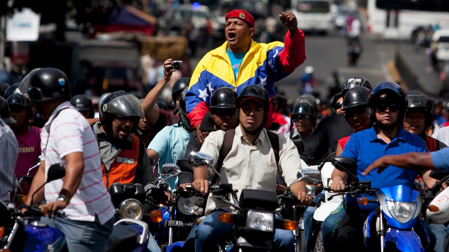 Motorcycles swarm streets of Venezuela's capital to protest proposed ...