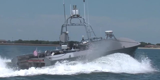 Navy arms unmanned attack drone boats with weapons, guns and missiles ...