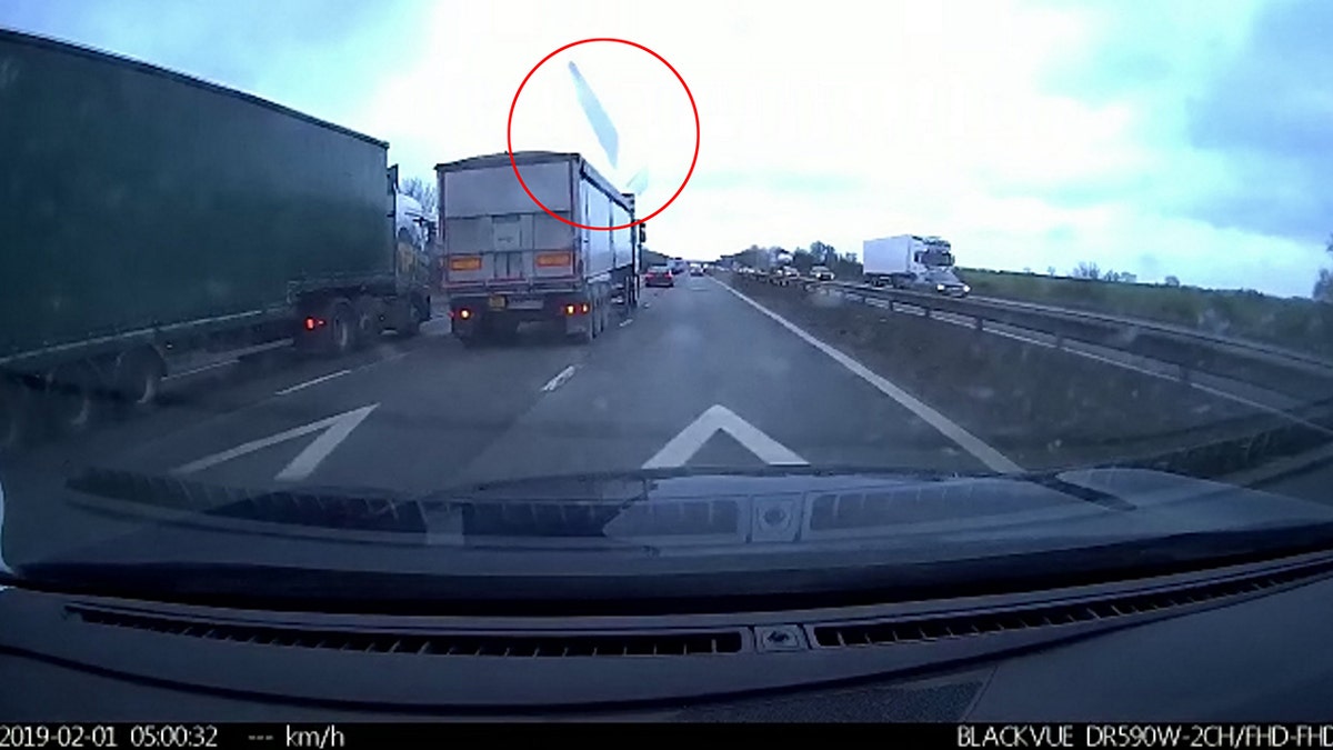 Ice sheet flies off truck and slams into car in dashcam video | Fox News