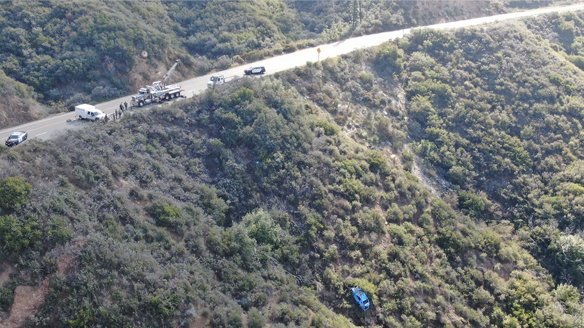 Mustang crashes off California cliff , gets pulled out by Hulk wrecker ...