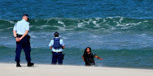 Australian beer-drinking mayor fined for flouting coronavirus social ...