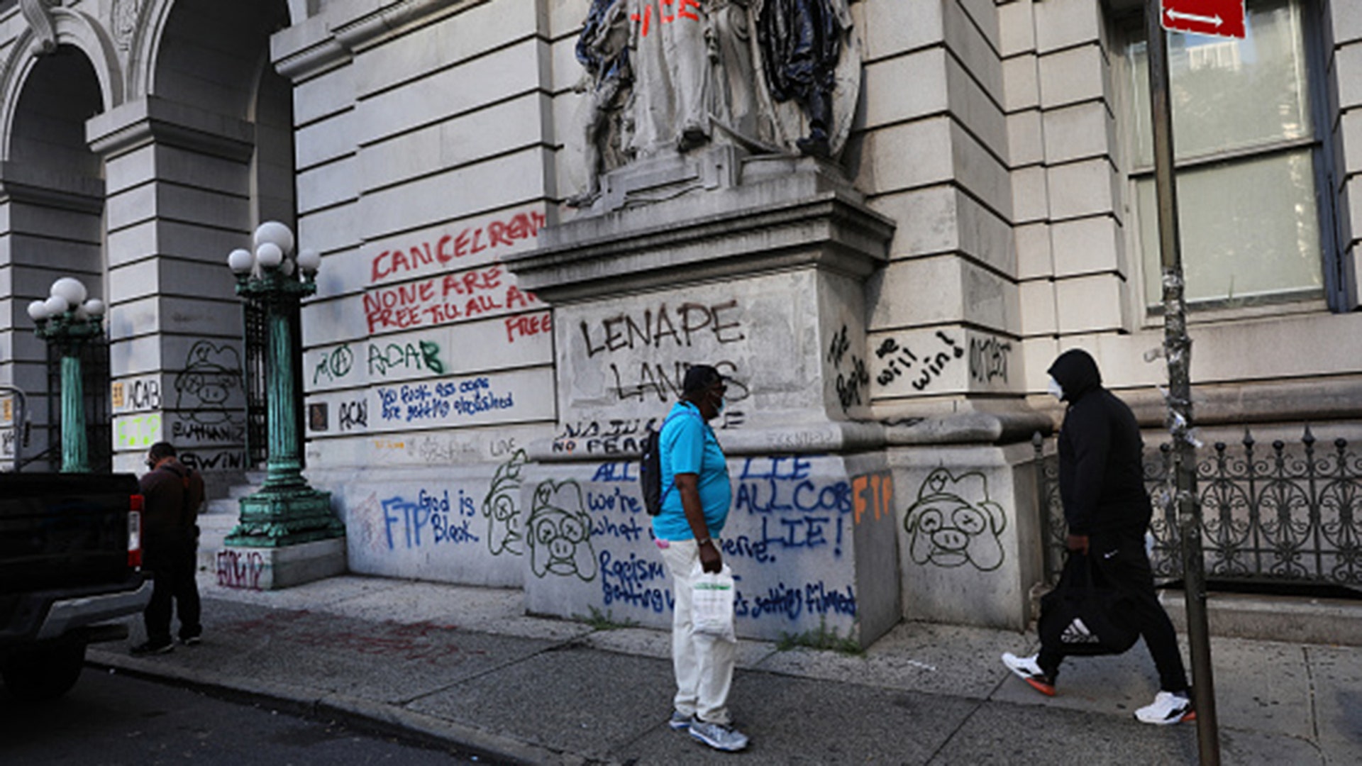 Manhattan covered in graffiti as demonstrators say NYPD budget cuts not ...